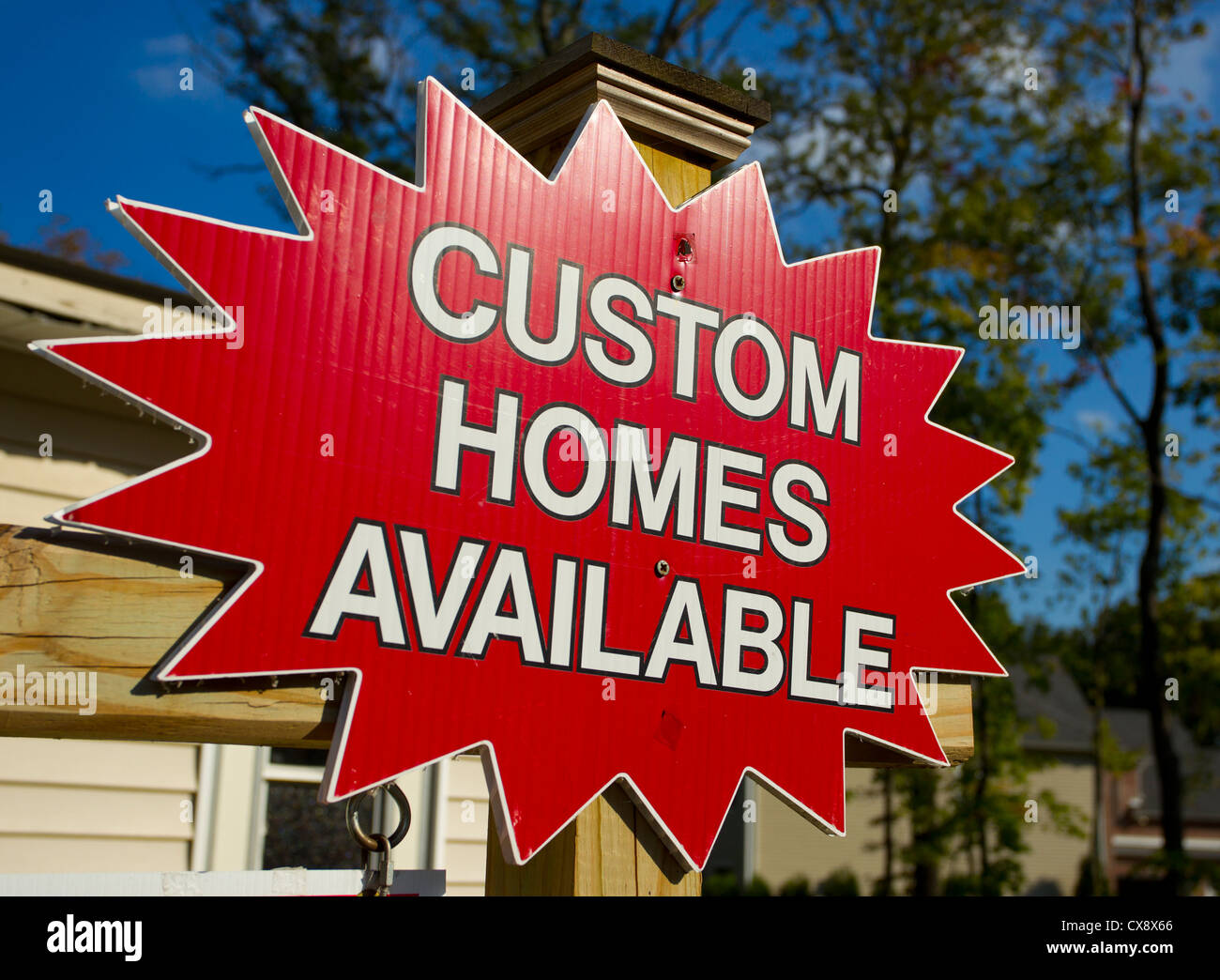 Custom homes sign at a building site Stock Photo - Alamy