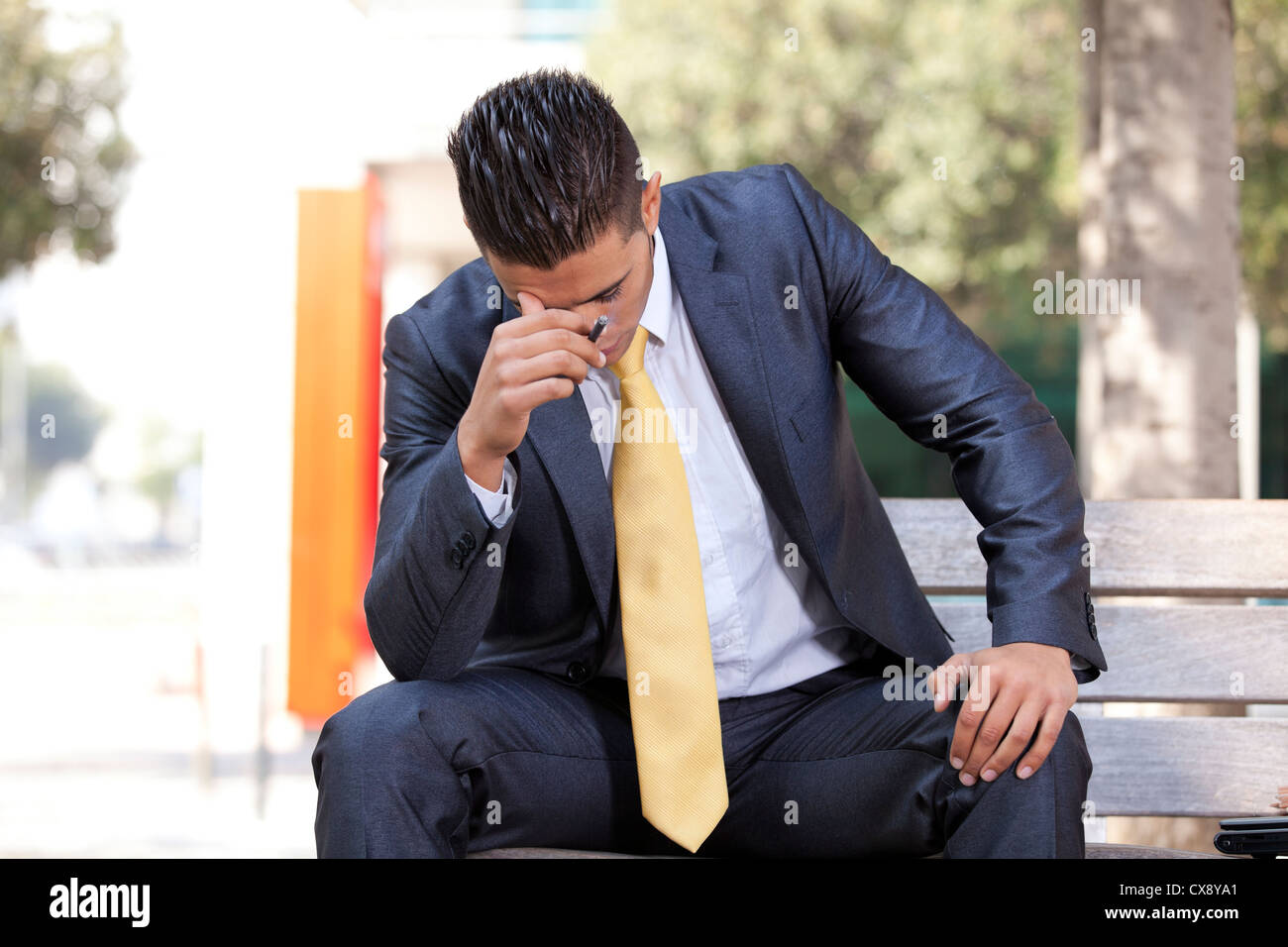 frustrated businessman smoking a cigar to relax Stock Photo - Alamy