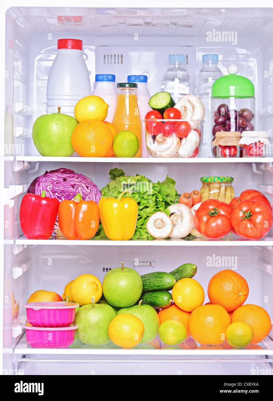 Shot of an open fridge with healthy food products Stock Photo - Alamy