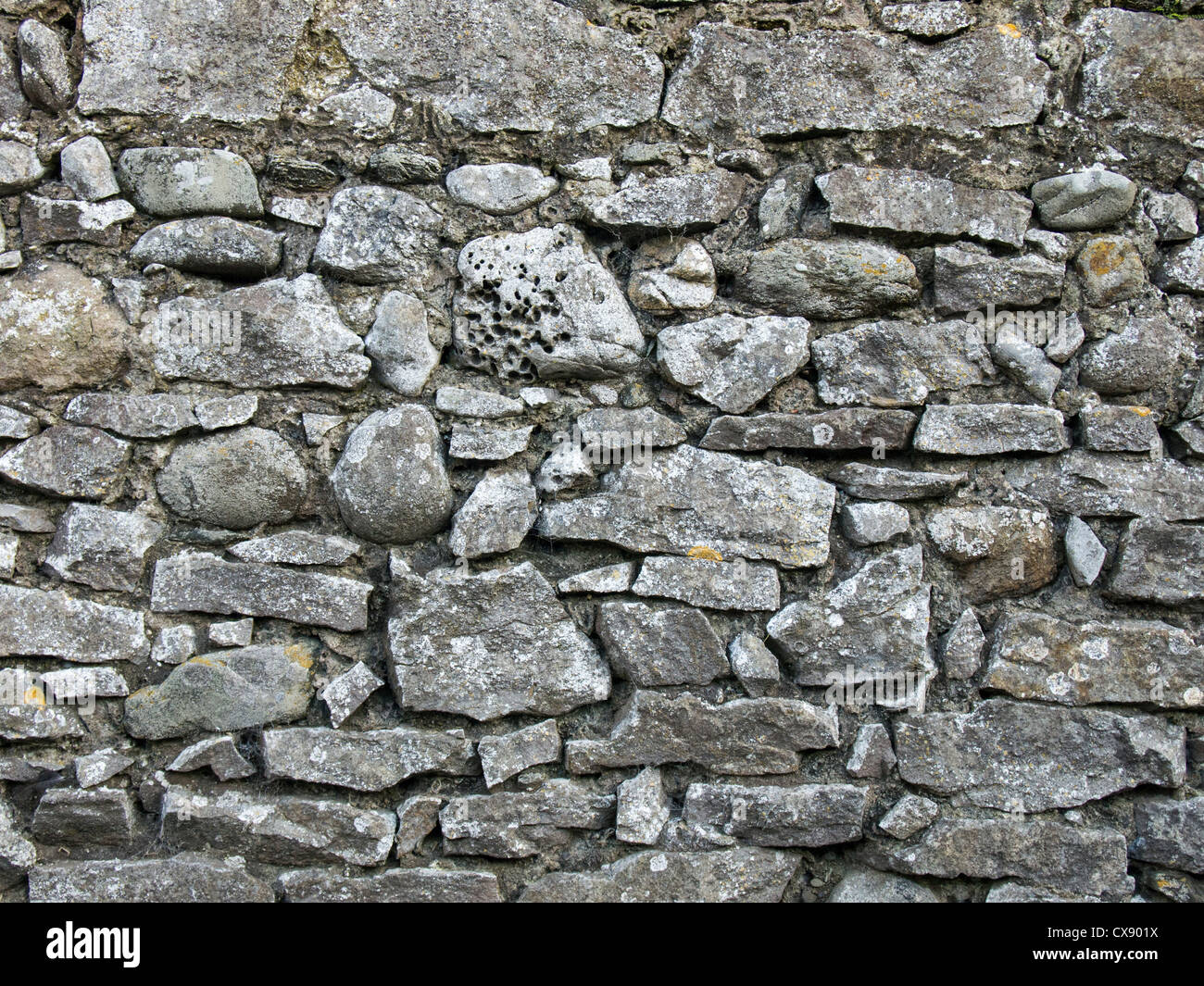 old stone wall - A section of a typical rubble-built stone wall in an ...