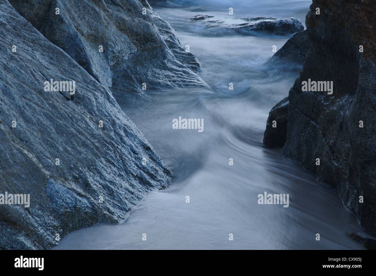 Waterflow between rocks Stock Photo - Alamy