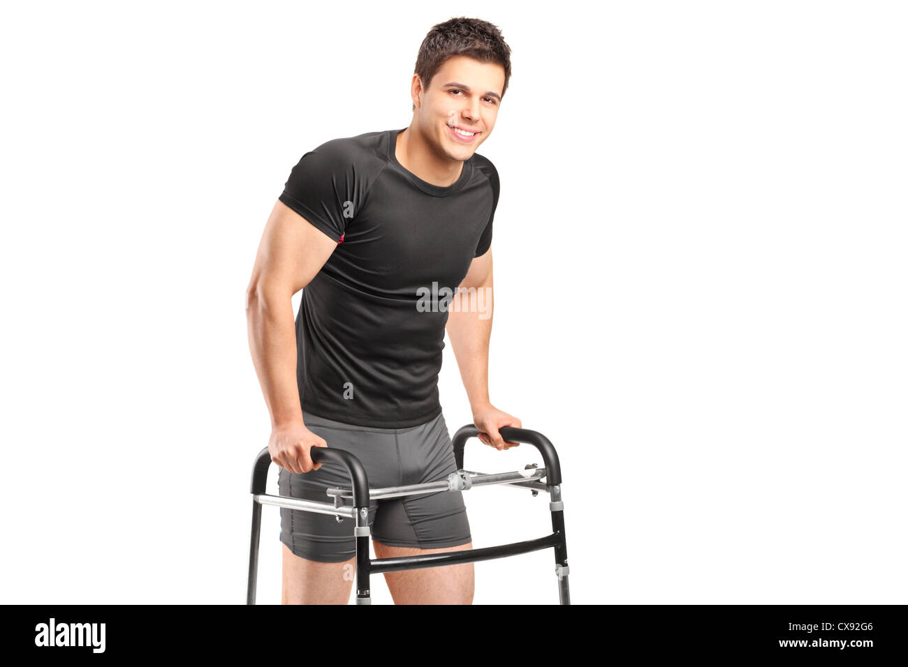 A young smiling athlete using a walker isolated on white background ...