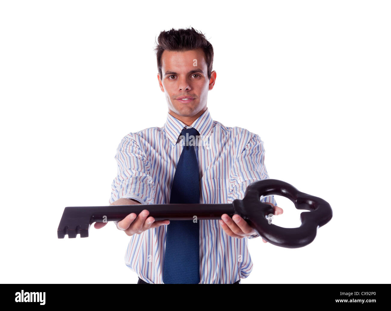 Businessman holding the big key to solve all the problems (isolated on ...