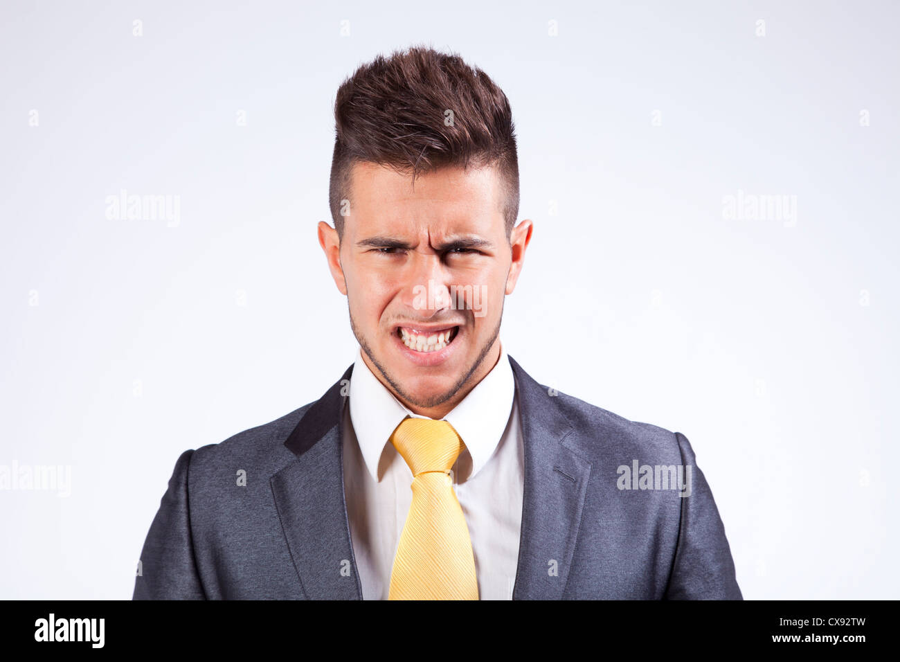Young businessman looking away Stock Photo - Alamy