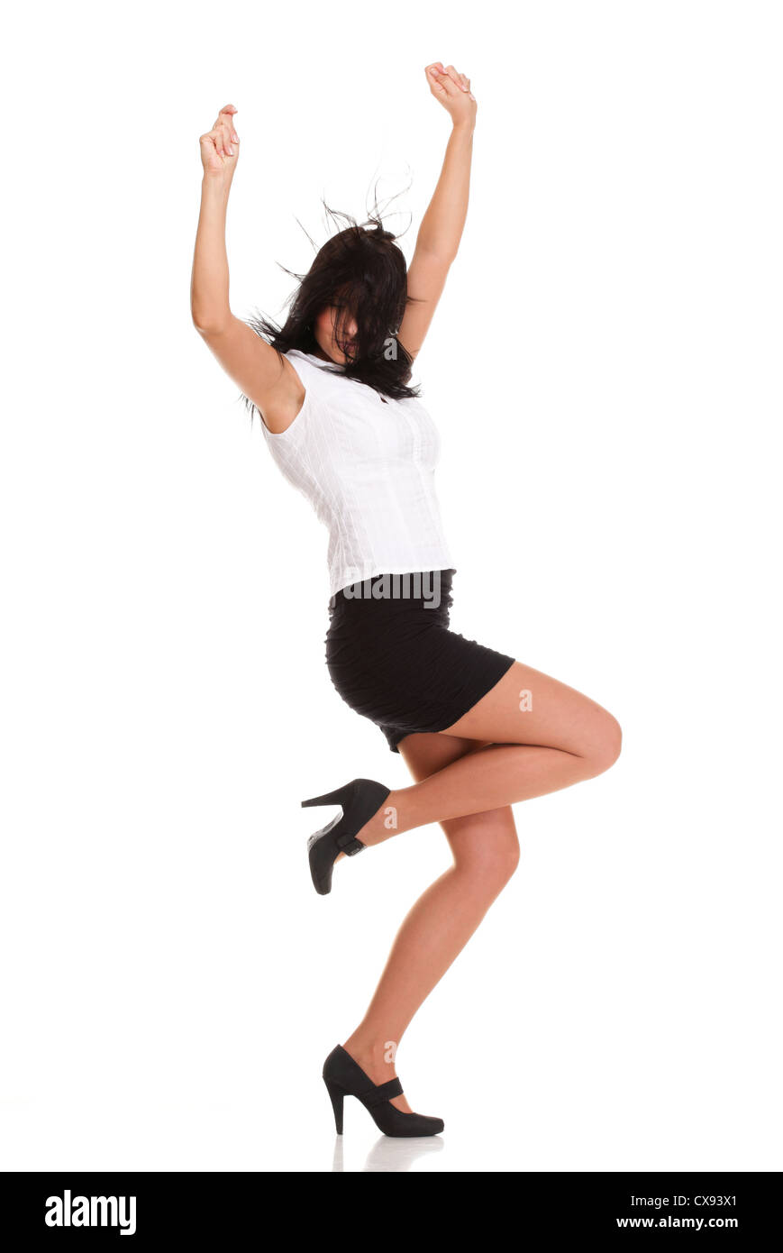 Woman clenching arms in excitement Stock Photo - Alamy