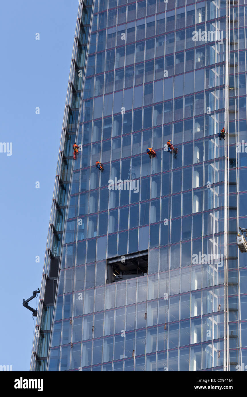 Window cleaners cleaning the glass windows of The Shard building in ...