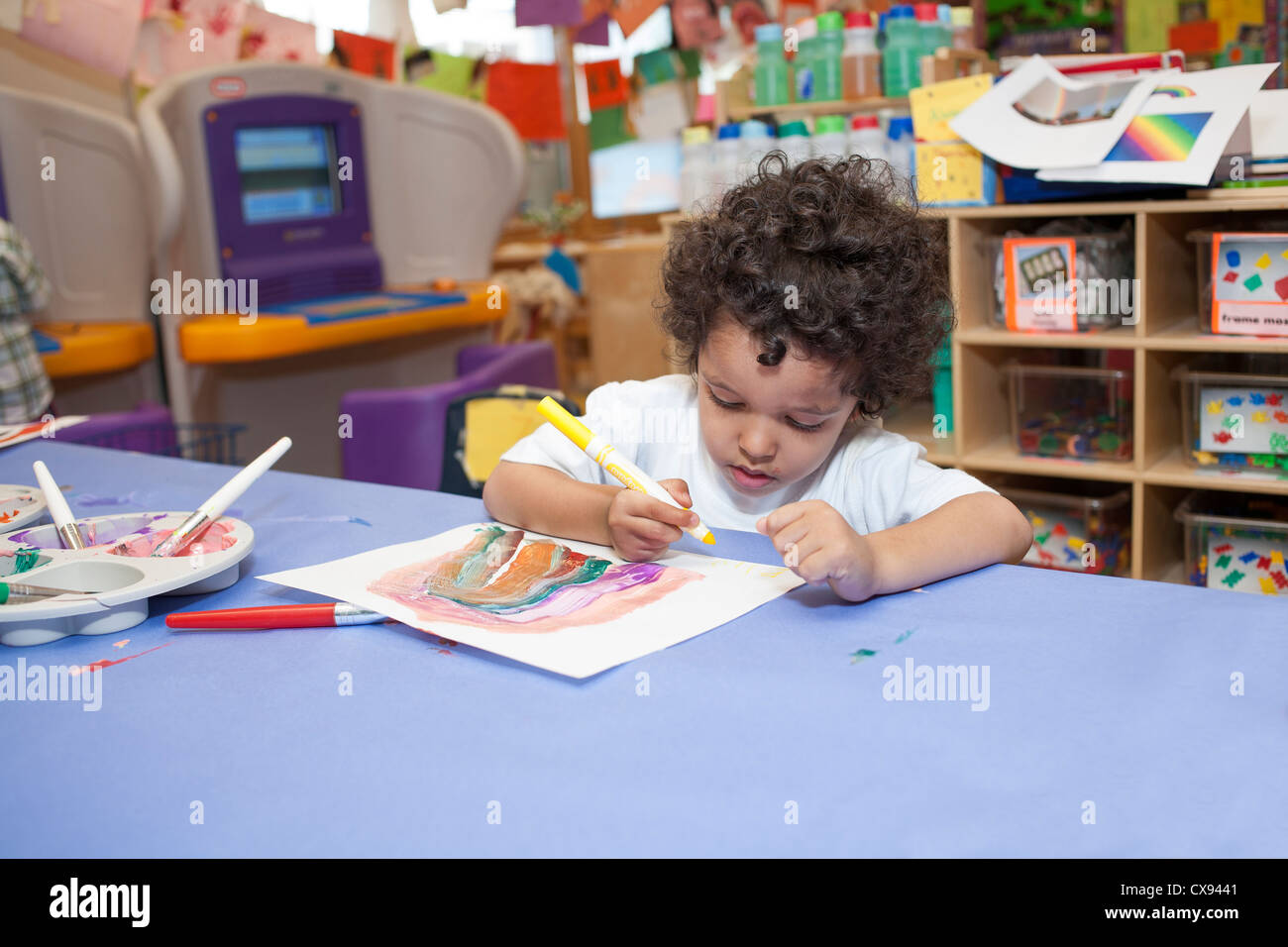 4 year old preschool boy drawing a picture Stock Photo - Alamy