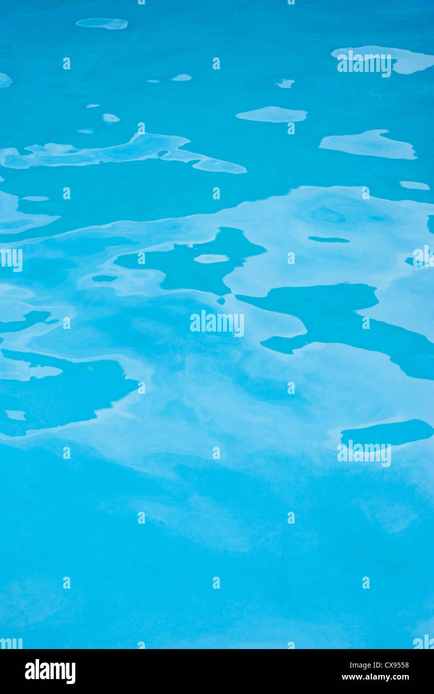 Silky deep blue pool water reflecting natural light Stock Photo - Alamy