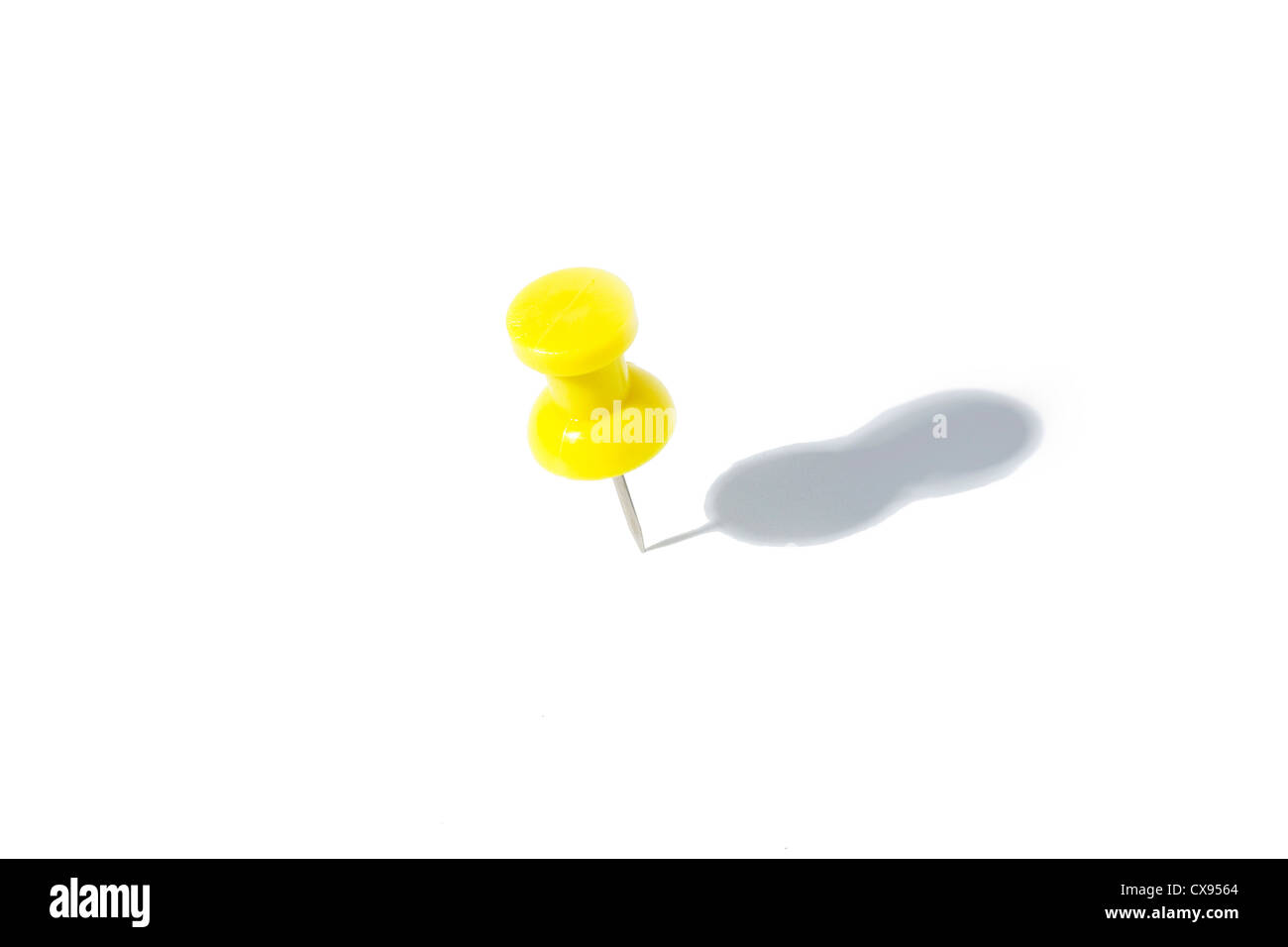 yellow pin on white background Stock Photo - Alamy