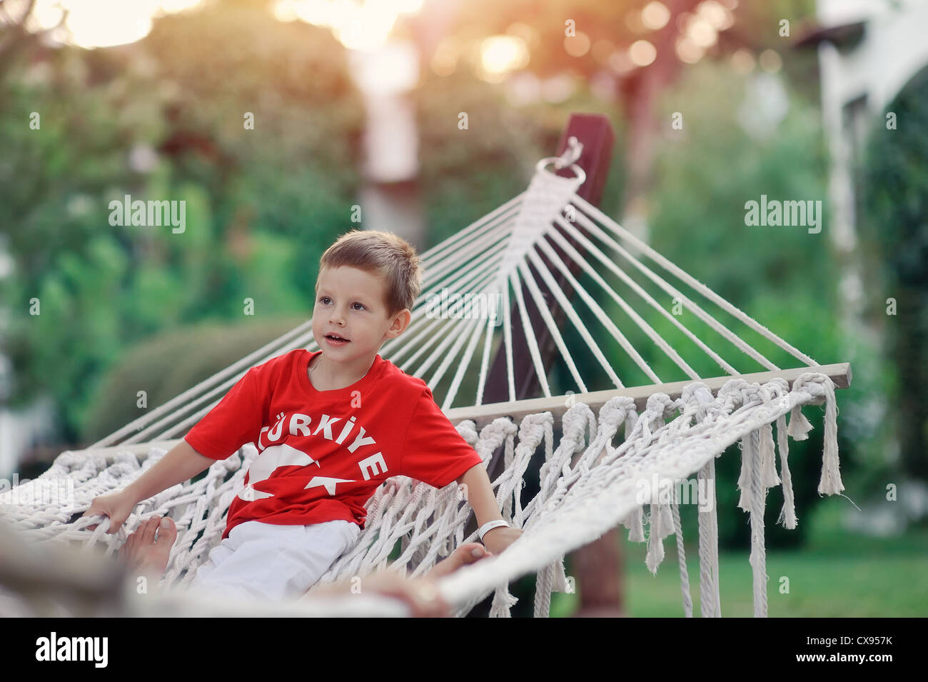 a boy and a hammock Stock Photo - Alamy