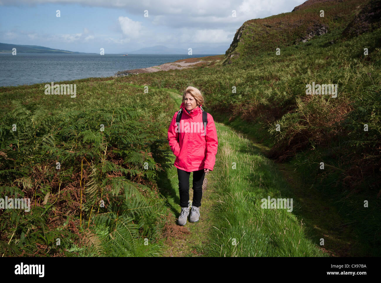 Front View Of A Woman Person Walking Through The Countryside Wearing ...