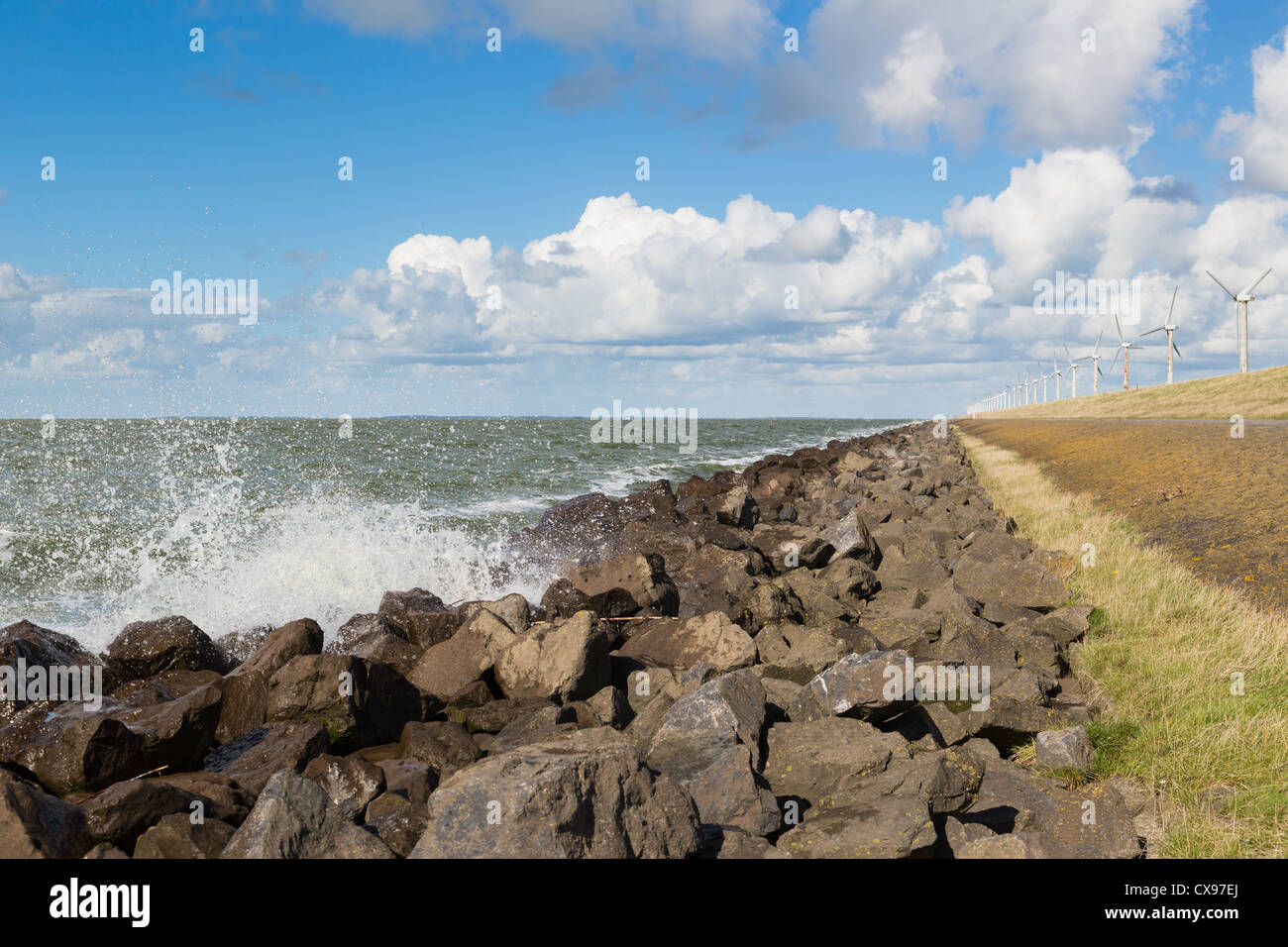 Waves near a Dutch breakwater with Windturbines Stock Photo - Alamy