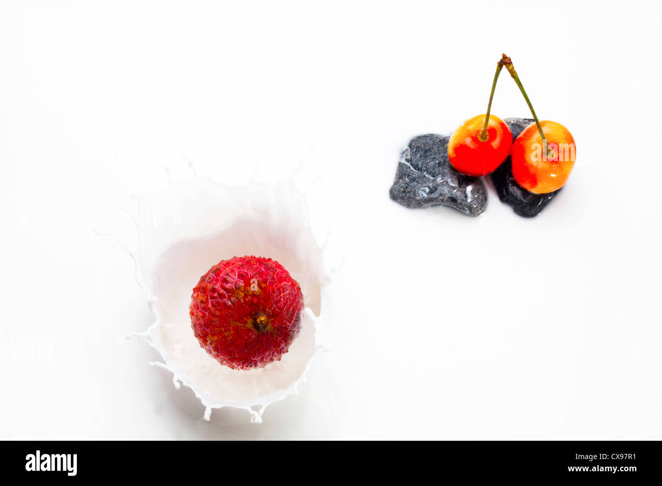 fruit drop into milk Stock Photo - Alamy