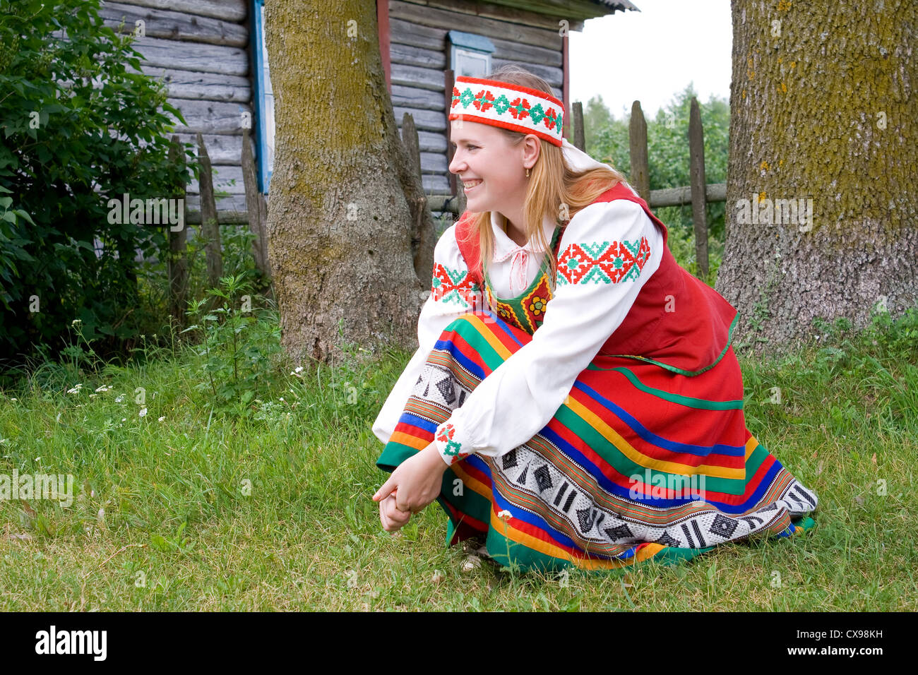 Portrait of a beautiful young women in national dress of the Belarus ...