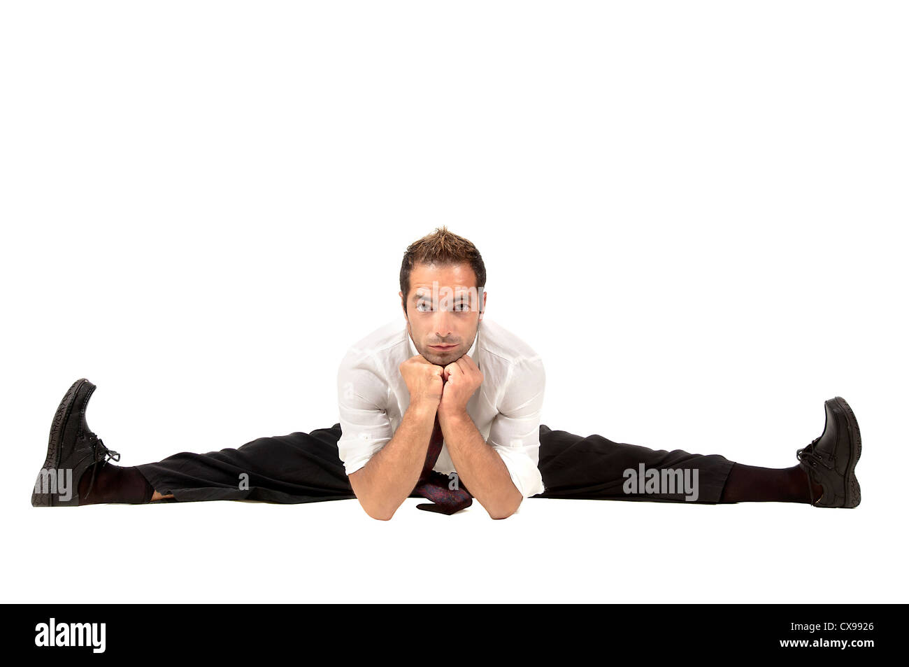 Businessman doing splits on the floor Stock Photo - Alamy