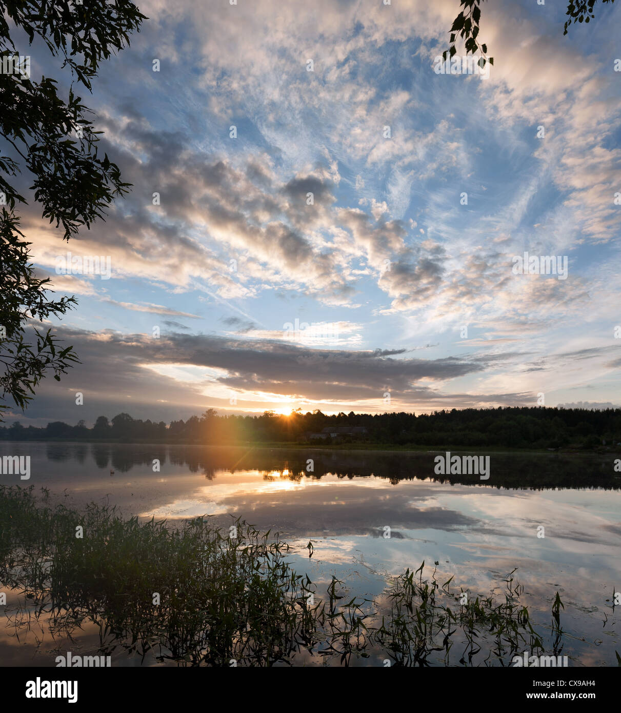Sunrise over the river. The first rays of sun Stock Photo - Alamy
