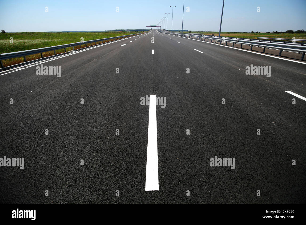 Color shot of a newly built highway with no traffic Stock Photo - Alamy