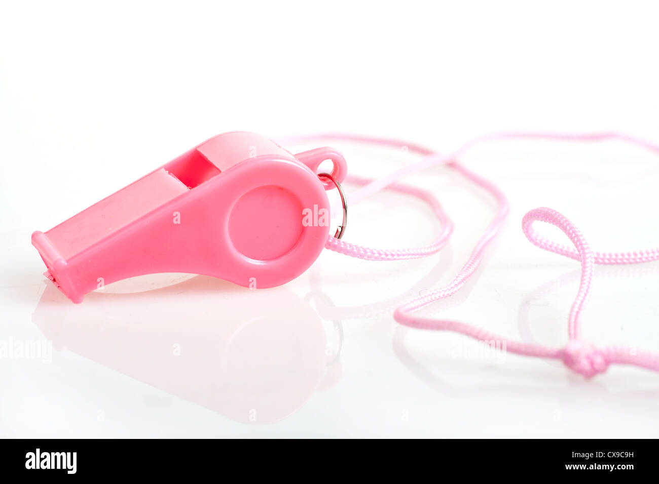 Pink whistle blower on a white background Stock Photo - Alamy