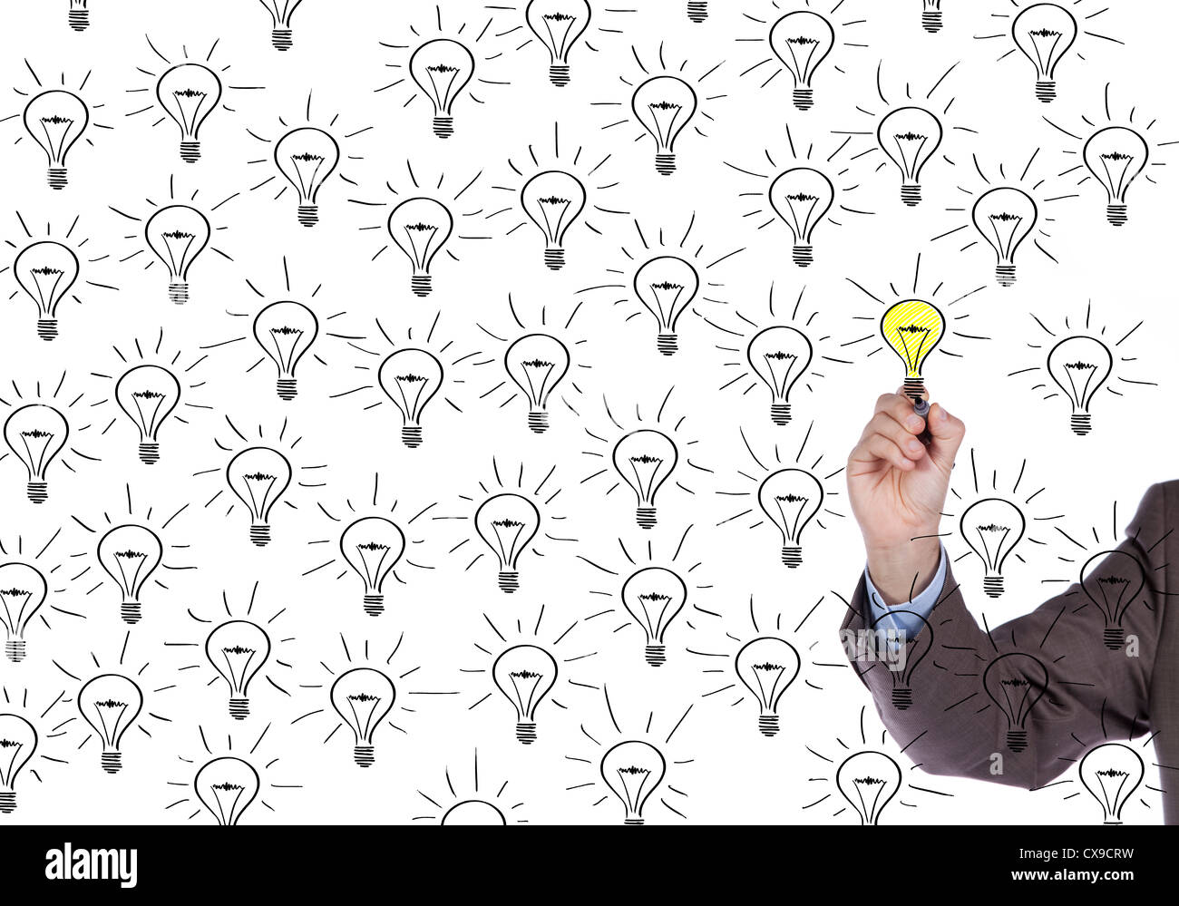 Businessman hand writing a different idea, in many ideas there are one ...