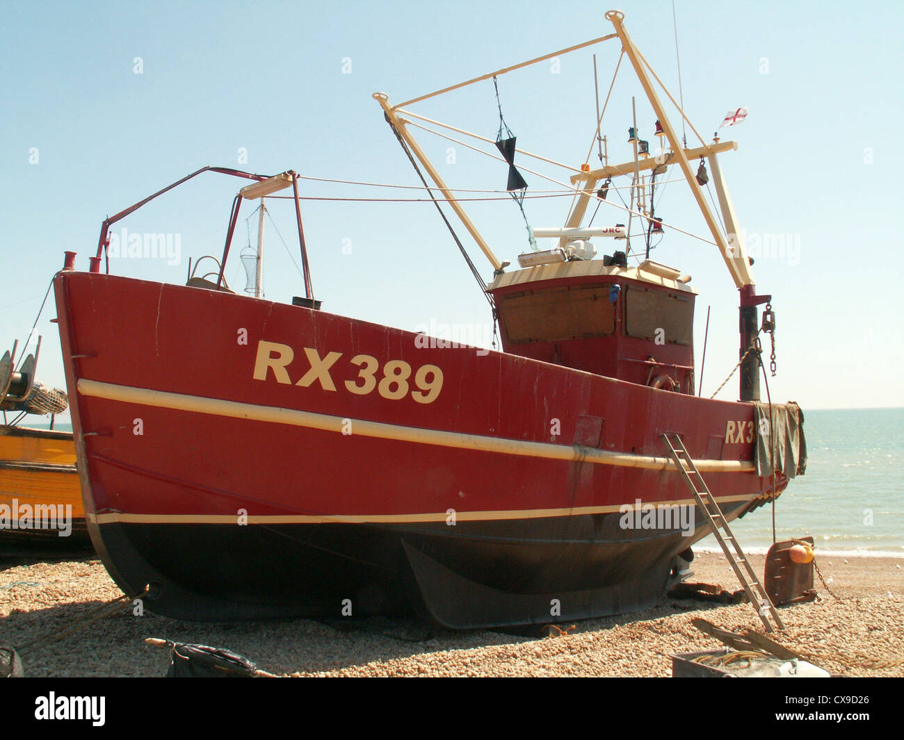 A fishing boat docked at a port, used for fishing and transporting ...