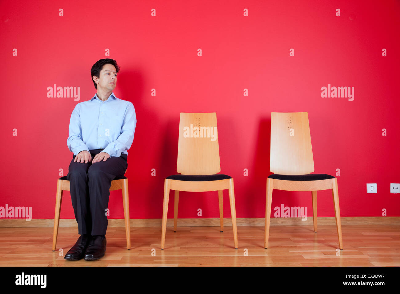 Business man standing next chair hi-res stock photography and images ...