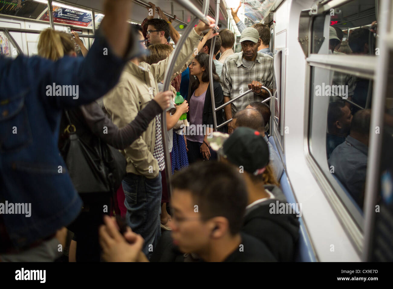 Travelers ride a Brooklyn bound New York subway. In 2011, weekday ...
