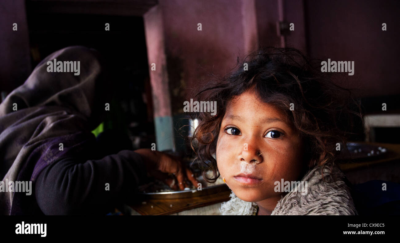 Poor girl and her family eating in a dirty cafe in Kathmandu, Nepal ...