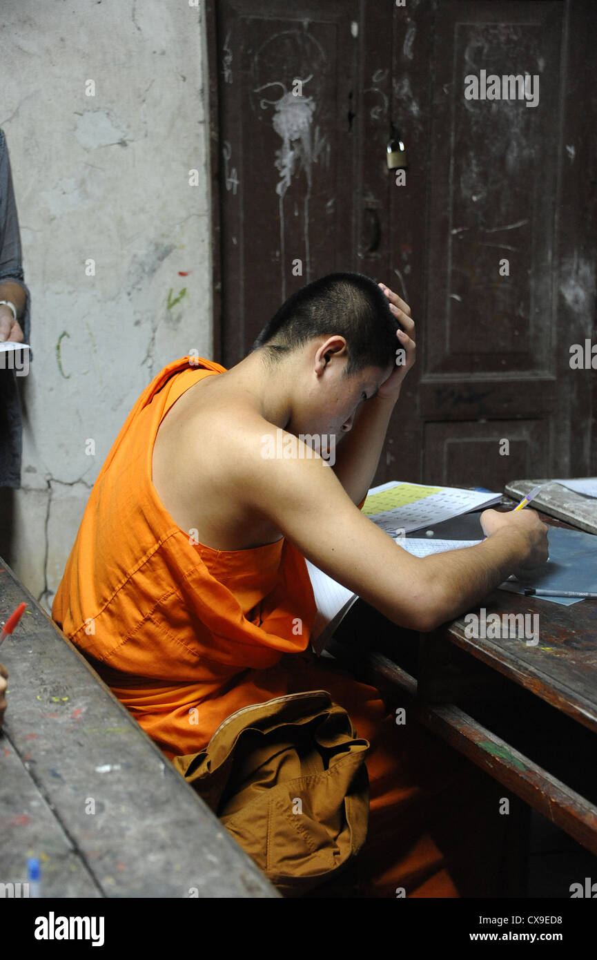 Student monk studying English in Laos temple Stock Photo - Alamy