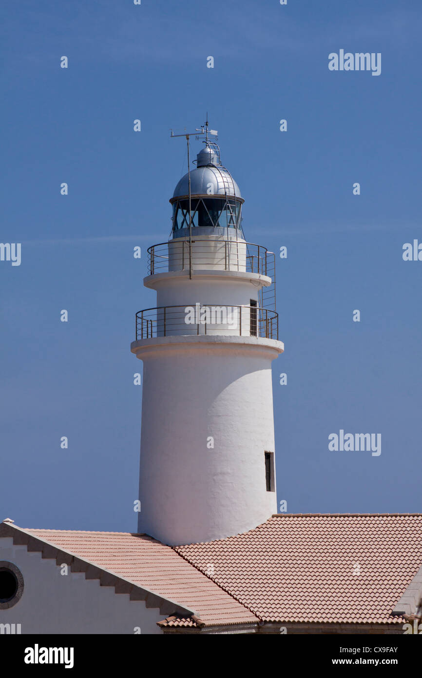 white lighthouse on rocks in the sea ocean water sky blue summer Stock ...