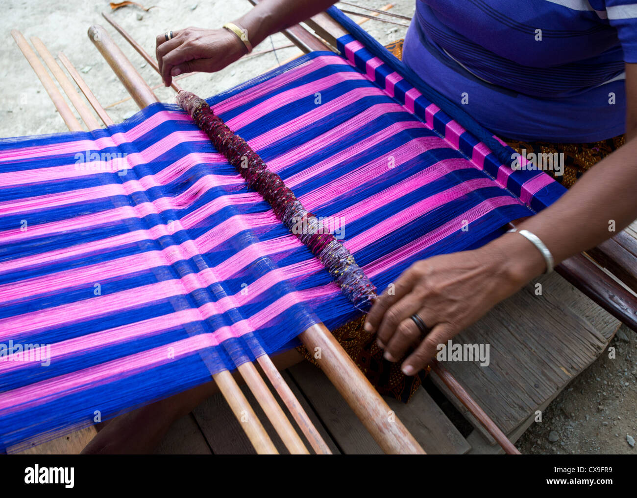 Woman weaving colourful tais fabric on a loom, Dili, East Timor Stock ...