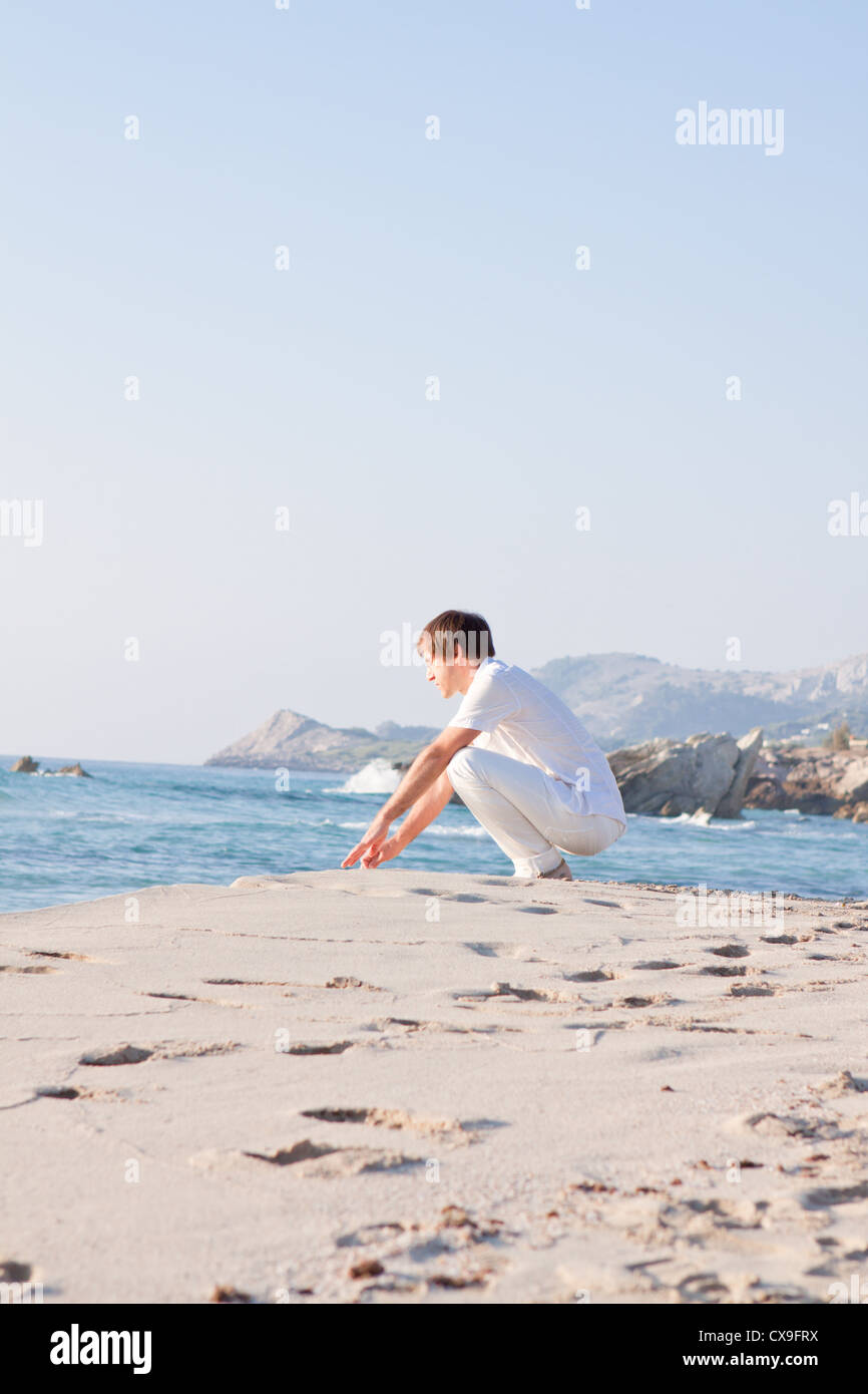 young man is relaxing on beach in summer vacation freedom Stock Photo ...