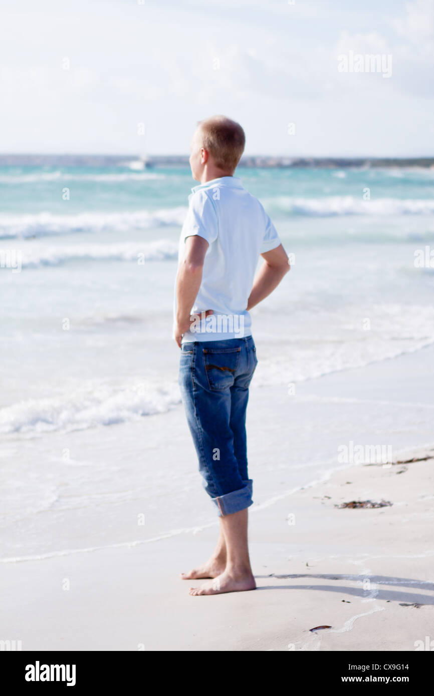 young man is relaxing on beach in summer vacation freedom Stock Photo ...