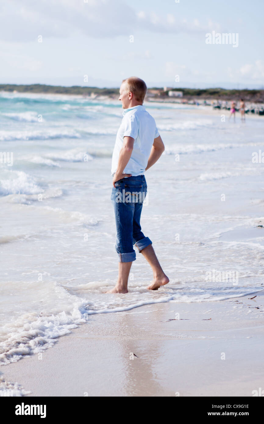 young man is relaxing on beach in summer vacation freedom Stock Photo ...