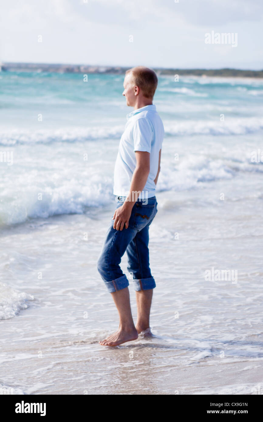 young man is relaxing on beach in summer vacation freedom Stock Photo ...