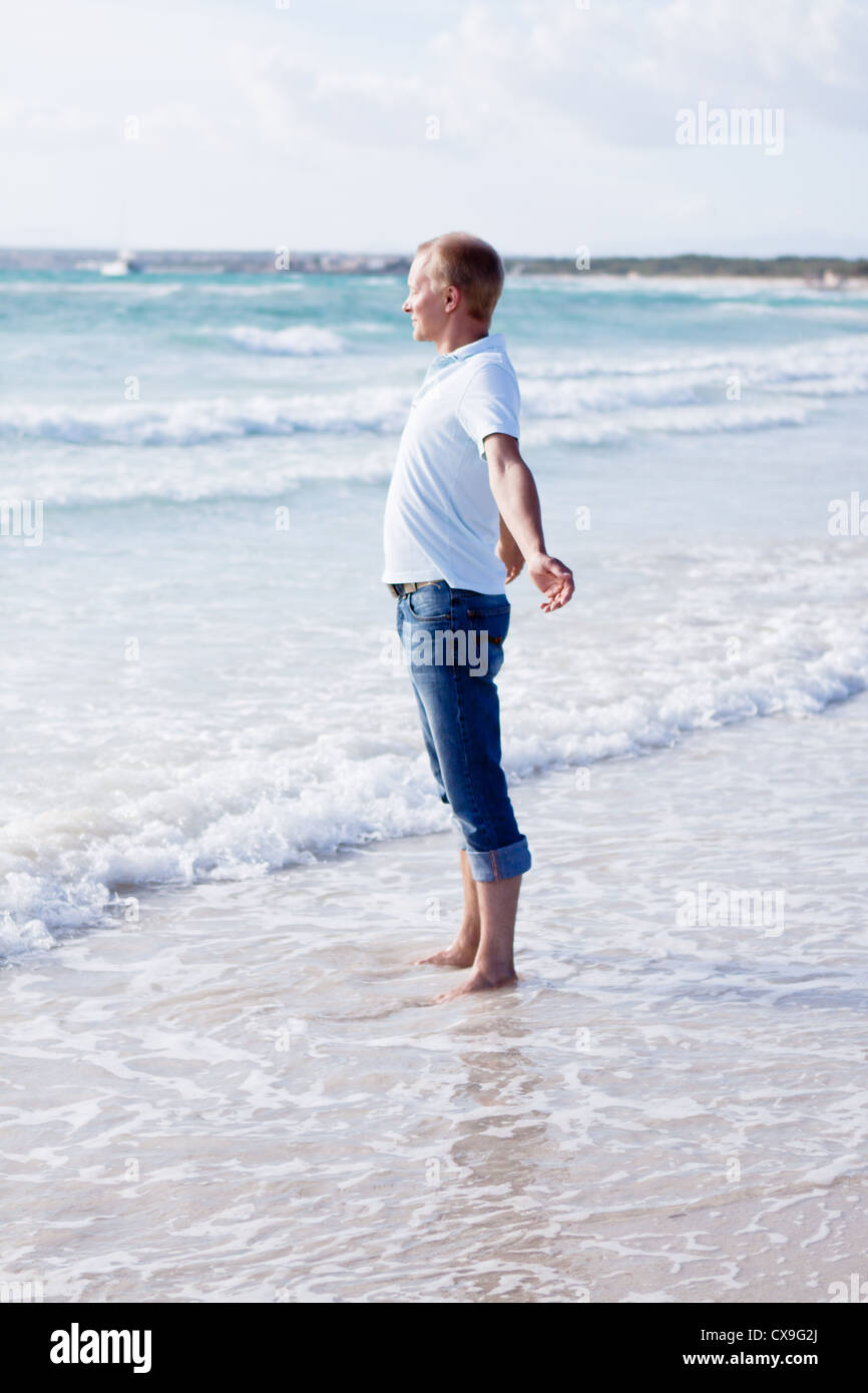 young man is relaxing on beach in summer vacation freedom Stock Photo ...