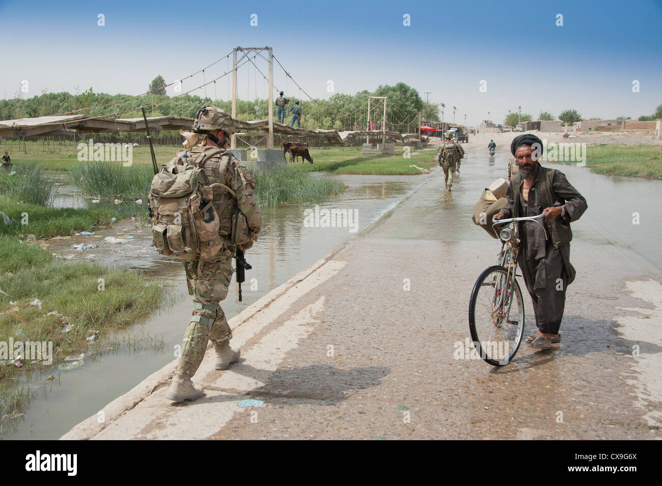 ISAF soldier meets Helmandi man at a ford: Helmand province ...