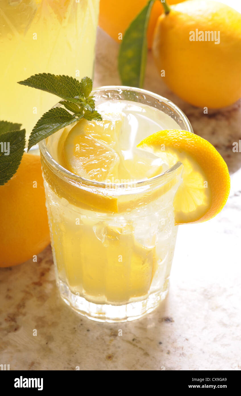 Close up of a Glass of Lemonade on counter in front of window with ...