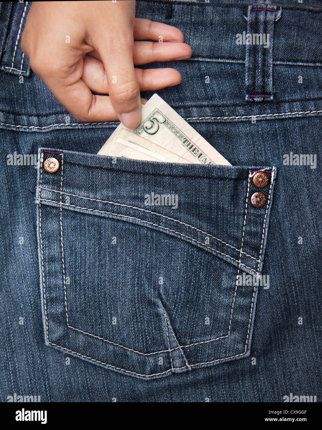 Human hand taking money from jean pocket Stock Photo - Alamy