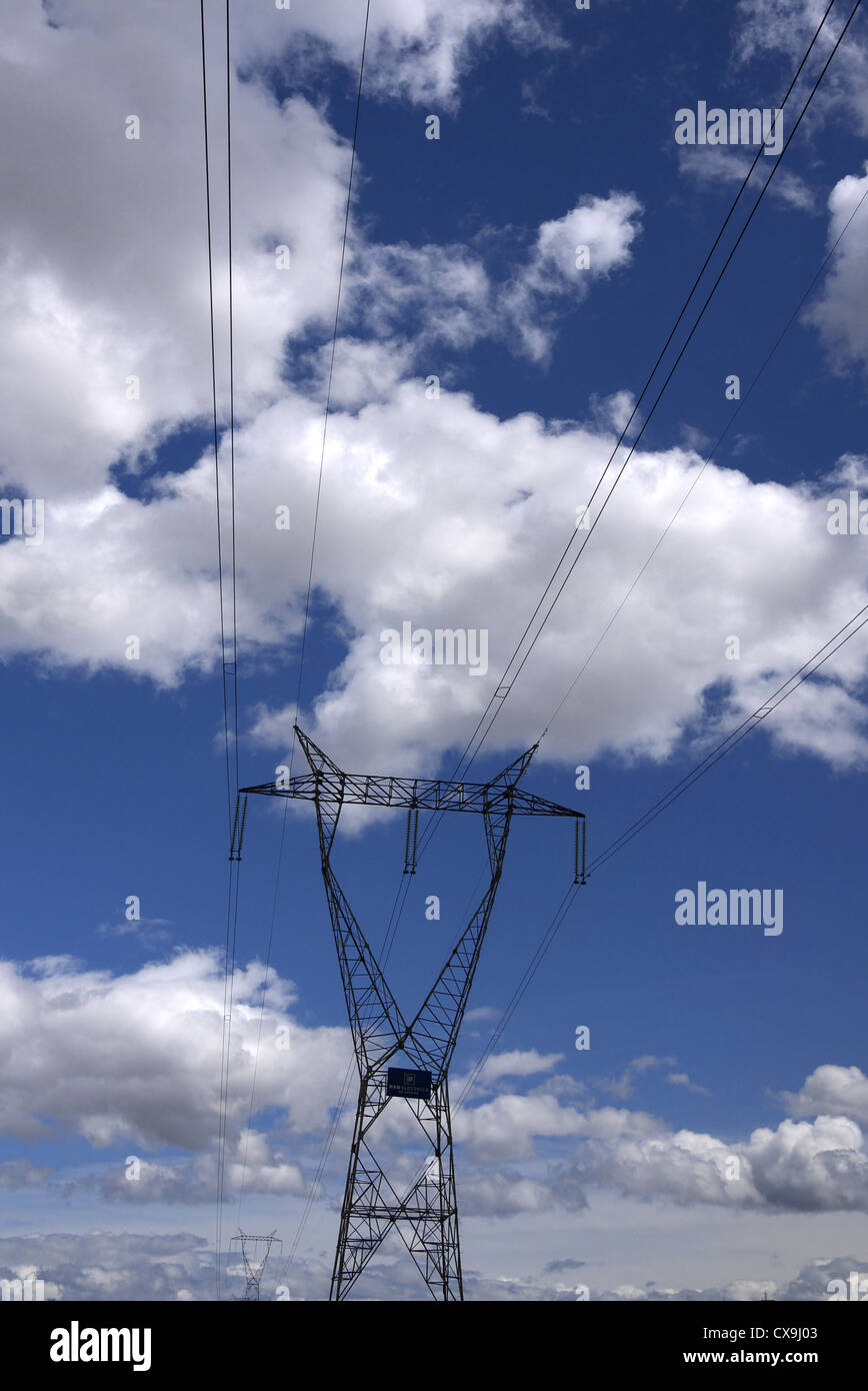 Power lines and pylon against a blue cloudy sky in Spain Stock Photo ...