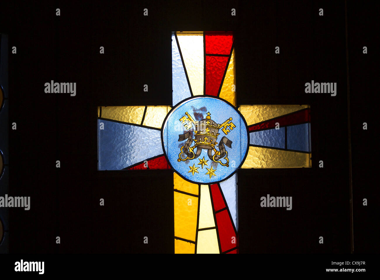 Stained glass window in the shape of a cross in a church in Spain Stock ...
