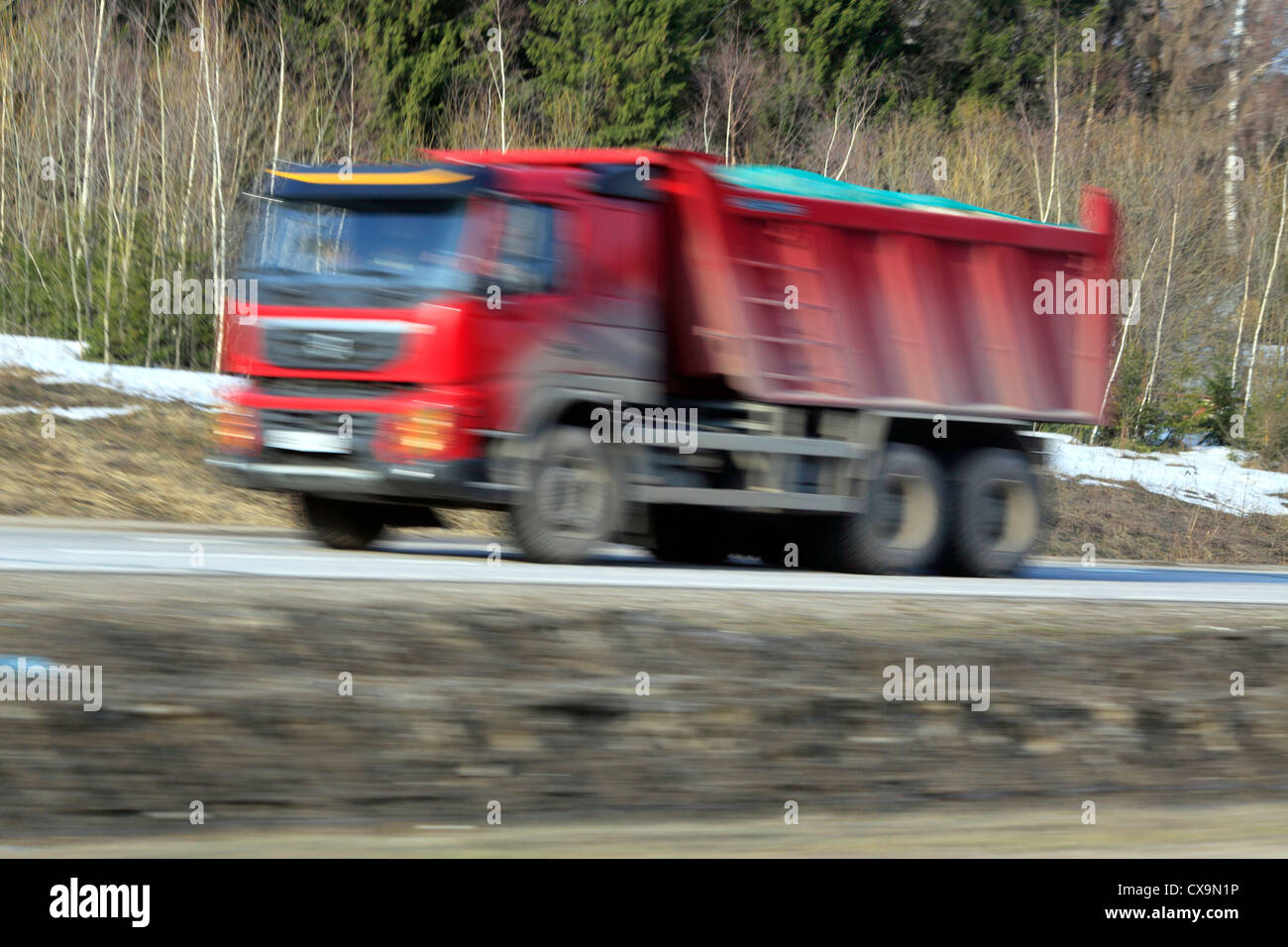 dumper track speeding on a highway Stock Photo - Alamy