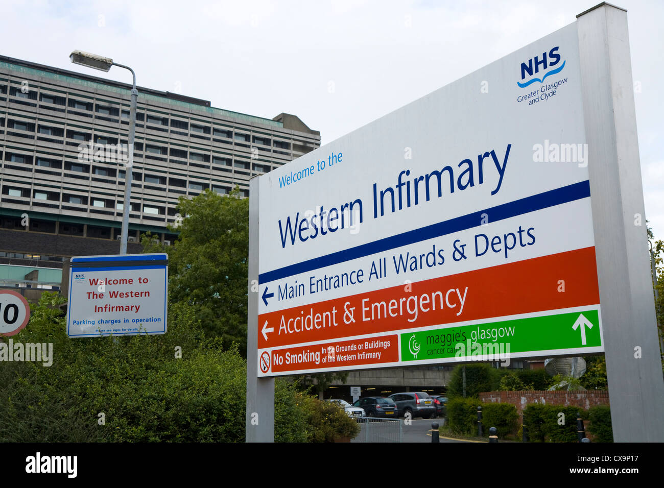 Sign and information signs and the Western Infirmary NHS Hospital, in ...
