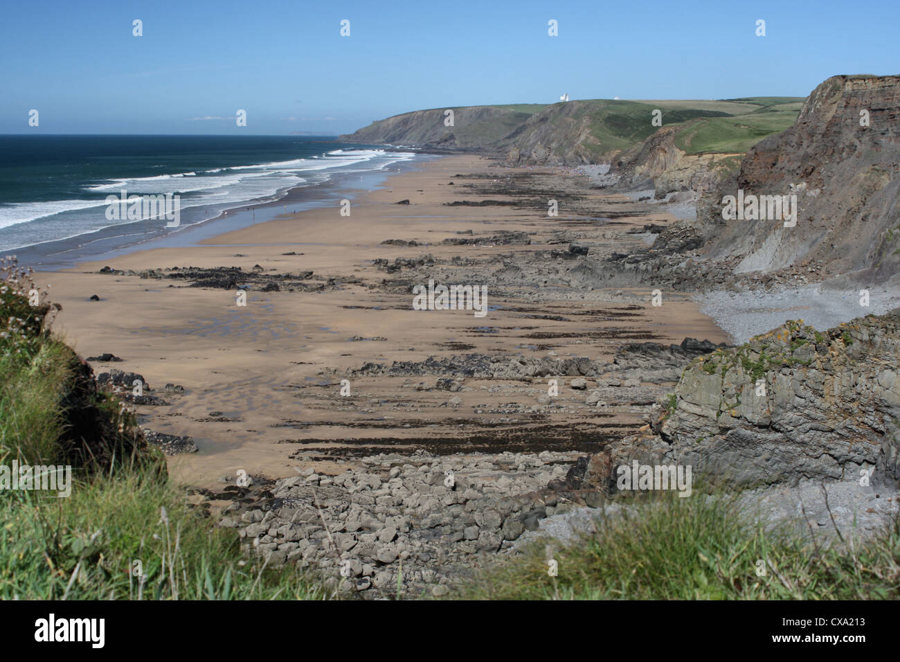 Bude beaches at Northcott bay and with people walking, paddling and ...