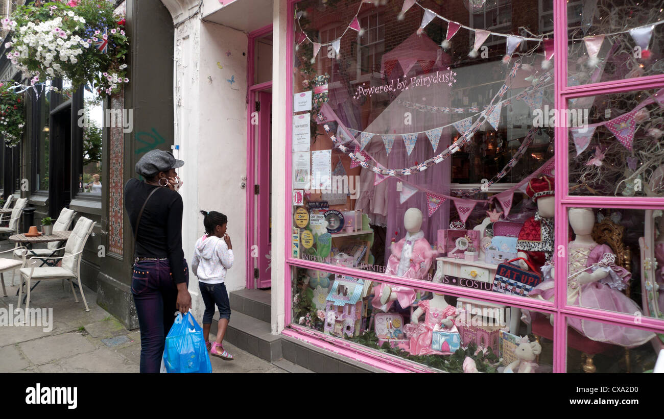 A woman and child outsid the pink Mystical Fairies shop on Flask Walk ...