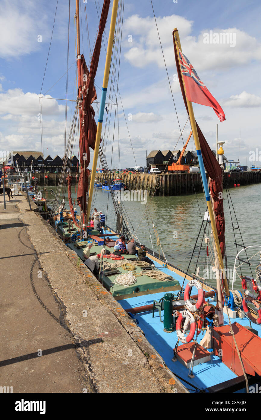 Whitstable Harbour scene with traditional sailing barge Greta preparing ...