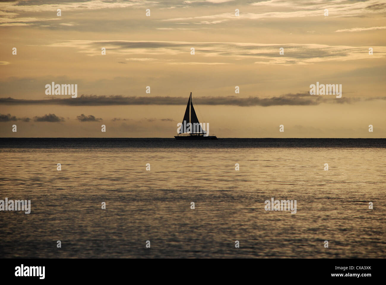 Sailing boat at sunset hi-res stock photography and images - Alamy