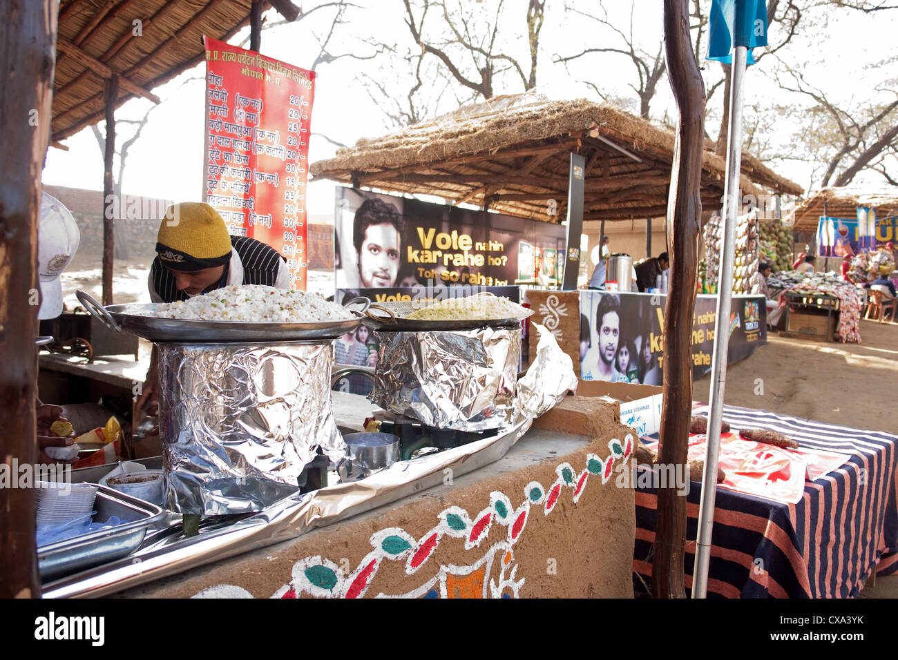 People staffing one of the food booths at the Surajkund Mela in Haryana ...
