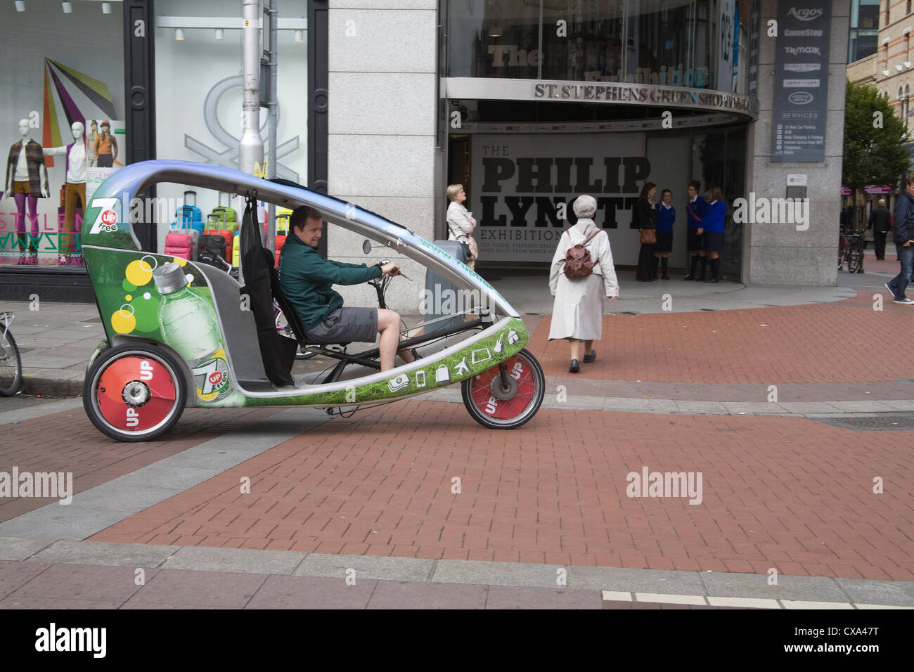 Dublin City Eire EU Young man riding a cycle rickshaw in city centre ...