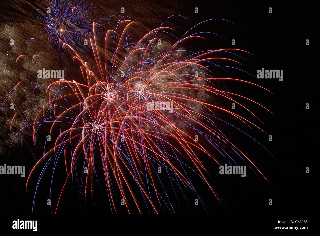 Blue and red fireworks Stock Photo - Alamy