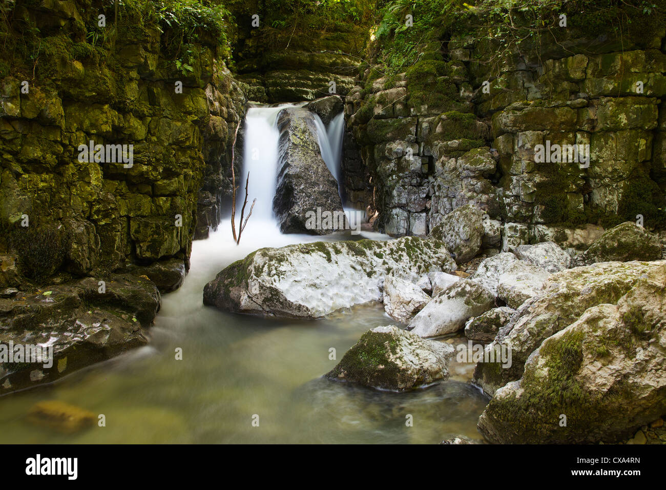 Waterfall in limestone gully at The Howk, Caldbeck, Lake District ...